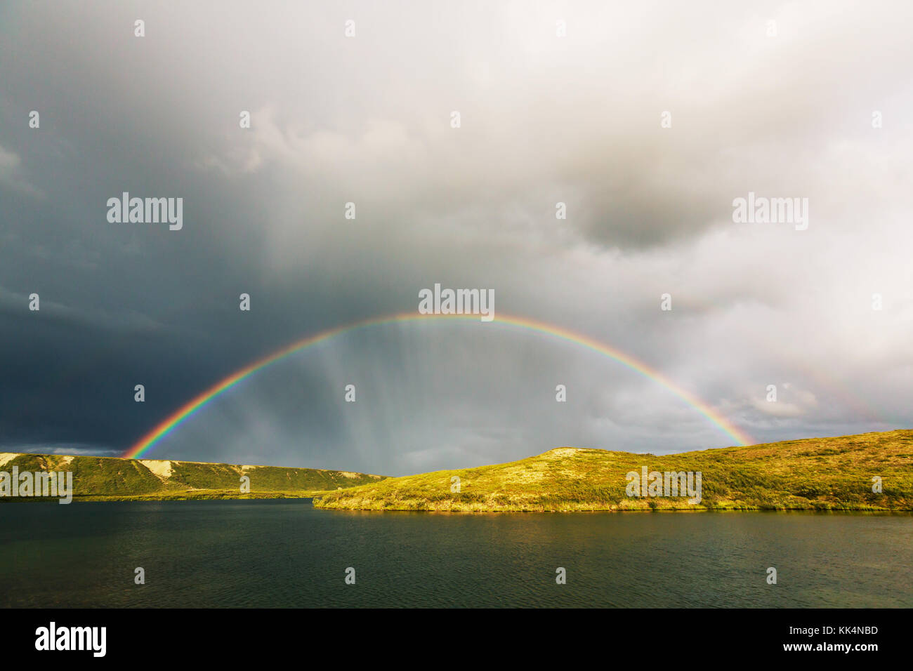 Rainbow above mountains, Alaska Stock Photo - Alamy