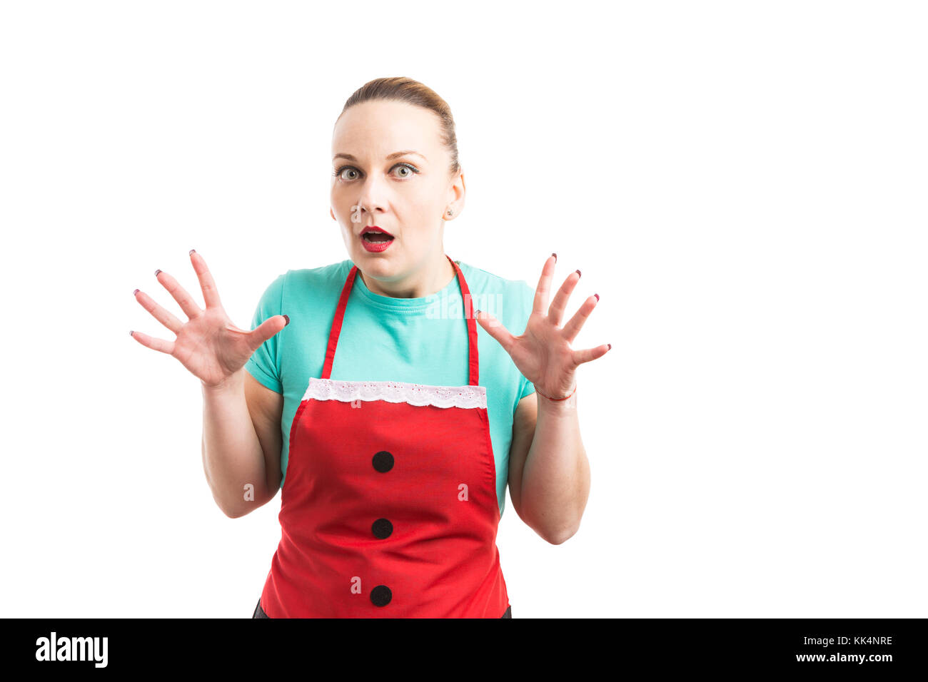Woman wearing red apron acting scared as panic and anxiety concept ...