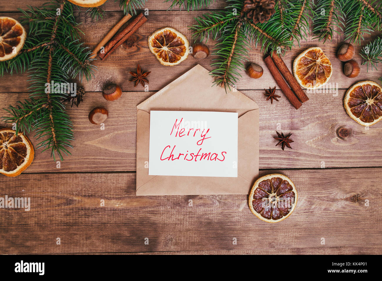 Merry Christmas text with food decorations on brown wooden table Stock ...