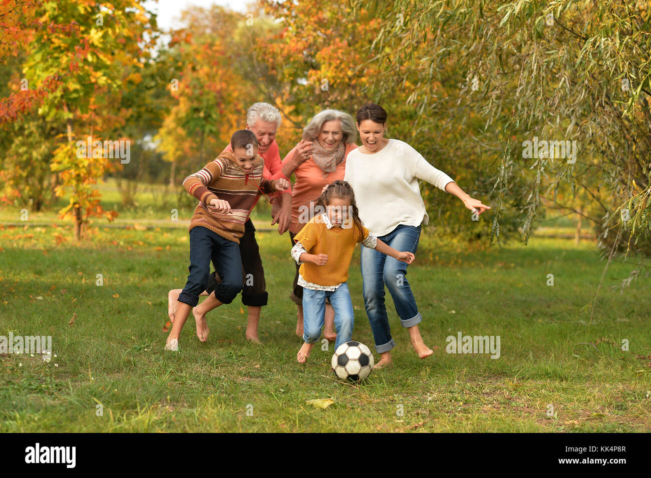 Big family playing football Stock Photo - Alamy