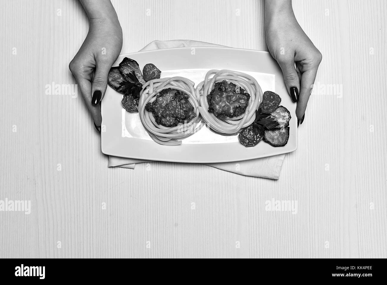 Dinner in the restaurant. Hands plates of food. Fork for eating Stock ...