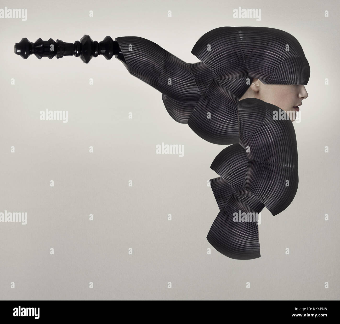 Female model profile in a black bizarre and surreal headgear Stock ...