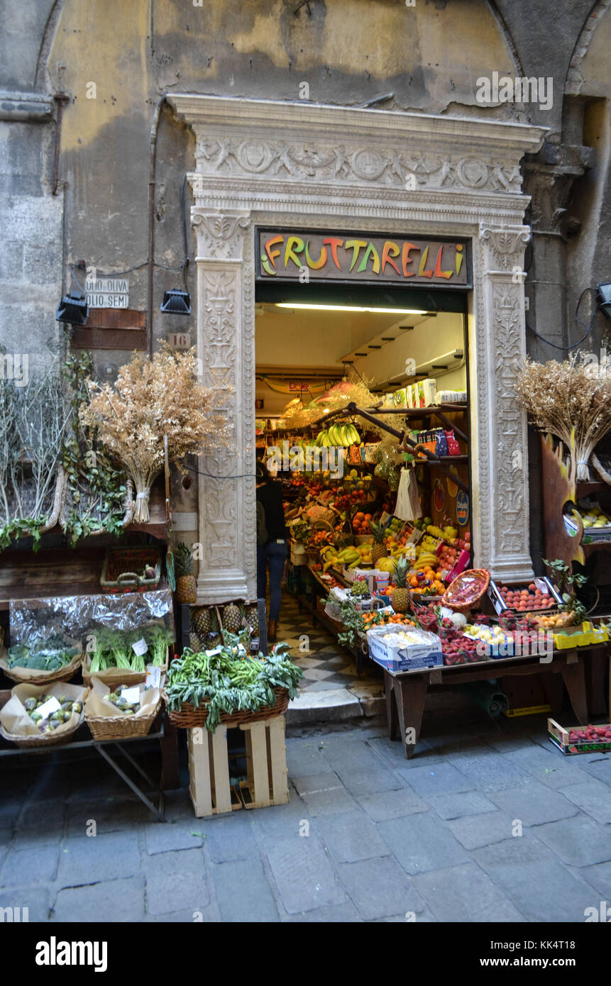 Italy: Genoa. Fruits and vegetable sold in a lane of the historic ...