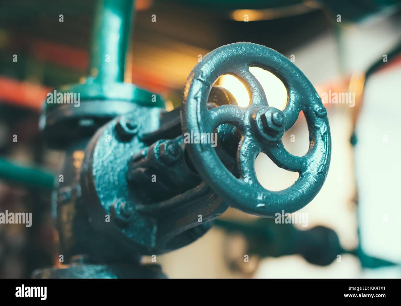 Green valve. Part of old power plant Stock Photo - Alamy