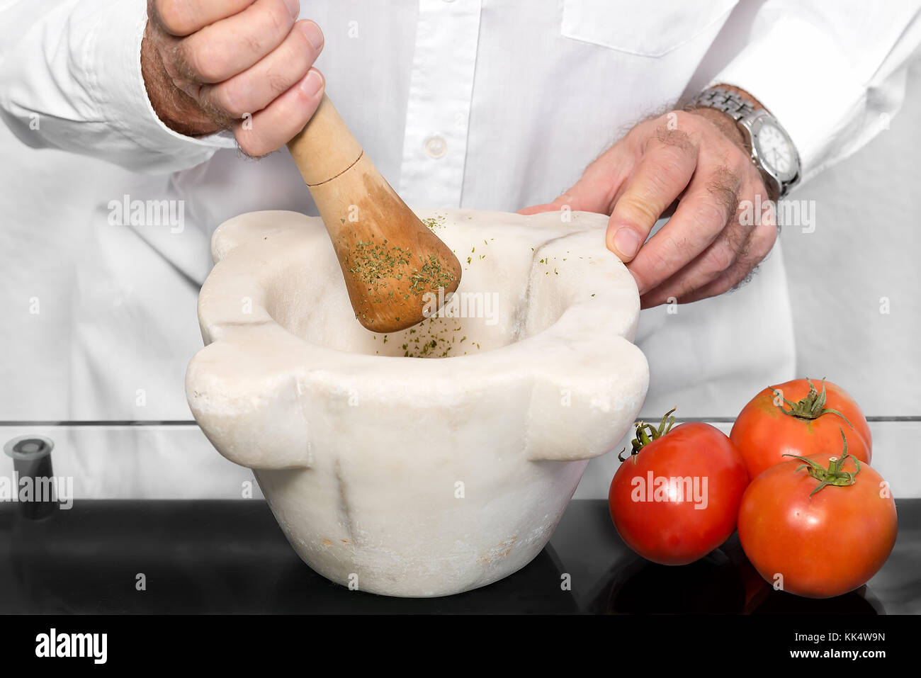 Cook with mortar on white background Stock Photo - Alamy