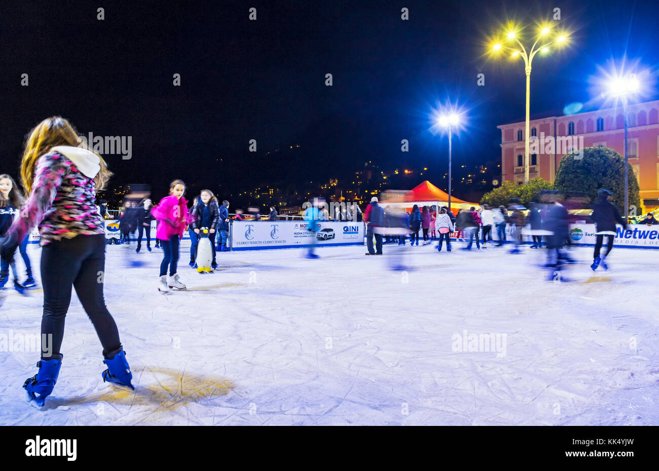 Ice skaters having fun on skating rink at annual traditional Christmas ...