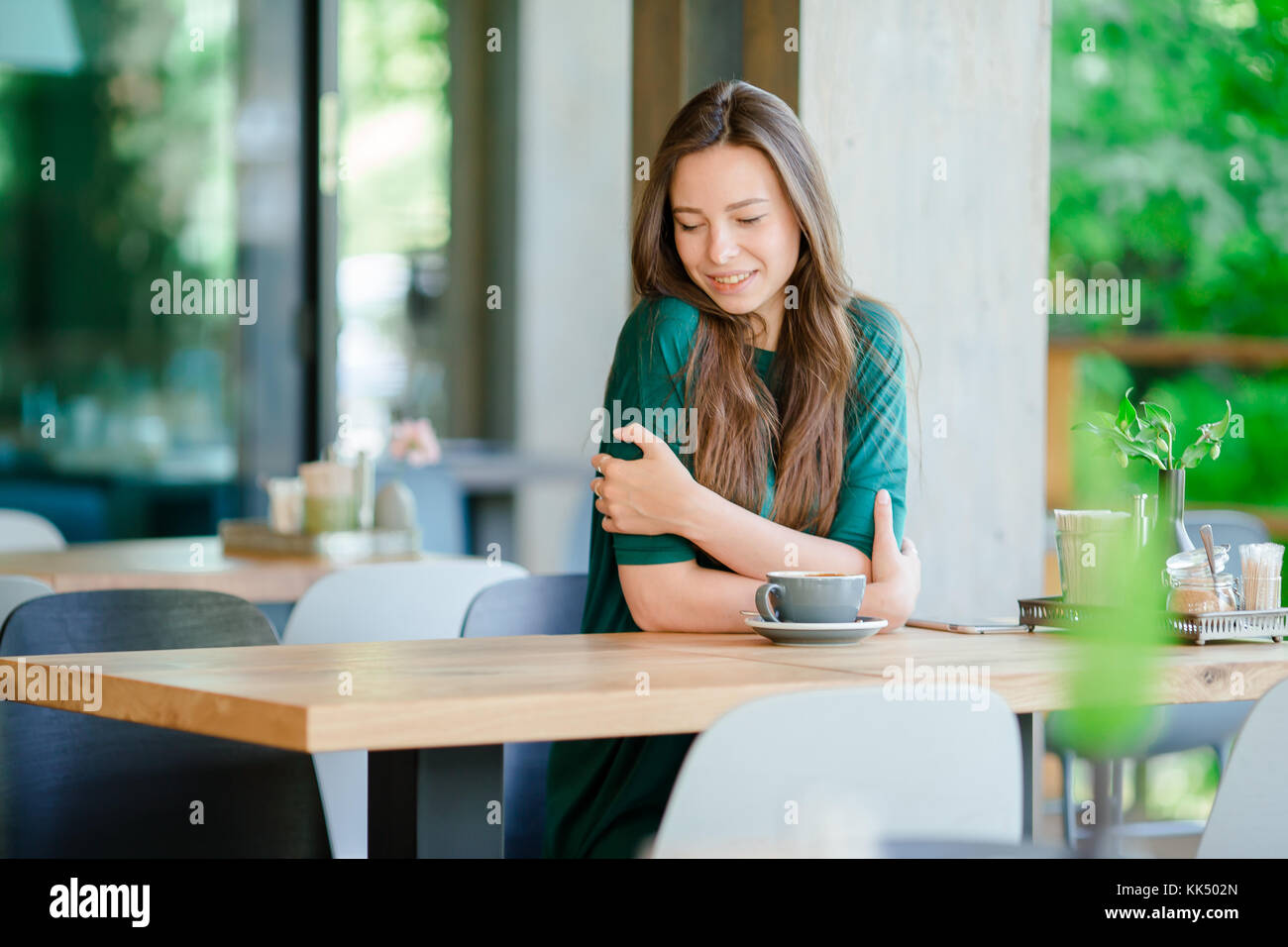Beautiful elegant girl having breakfast at outdoor cafe Stock Photo - Alamy