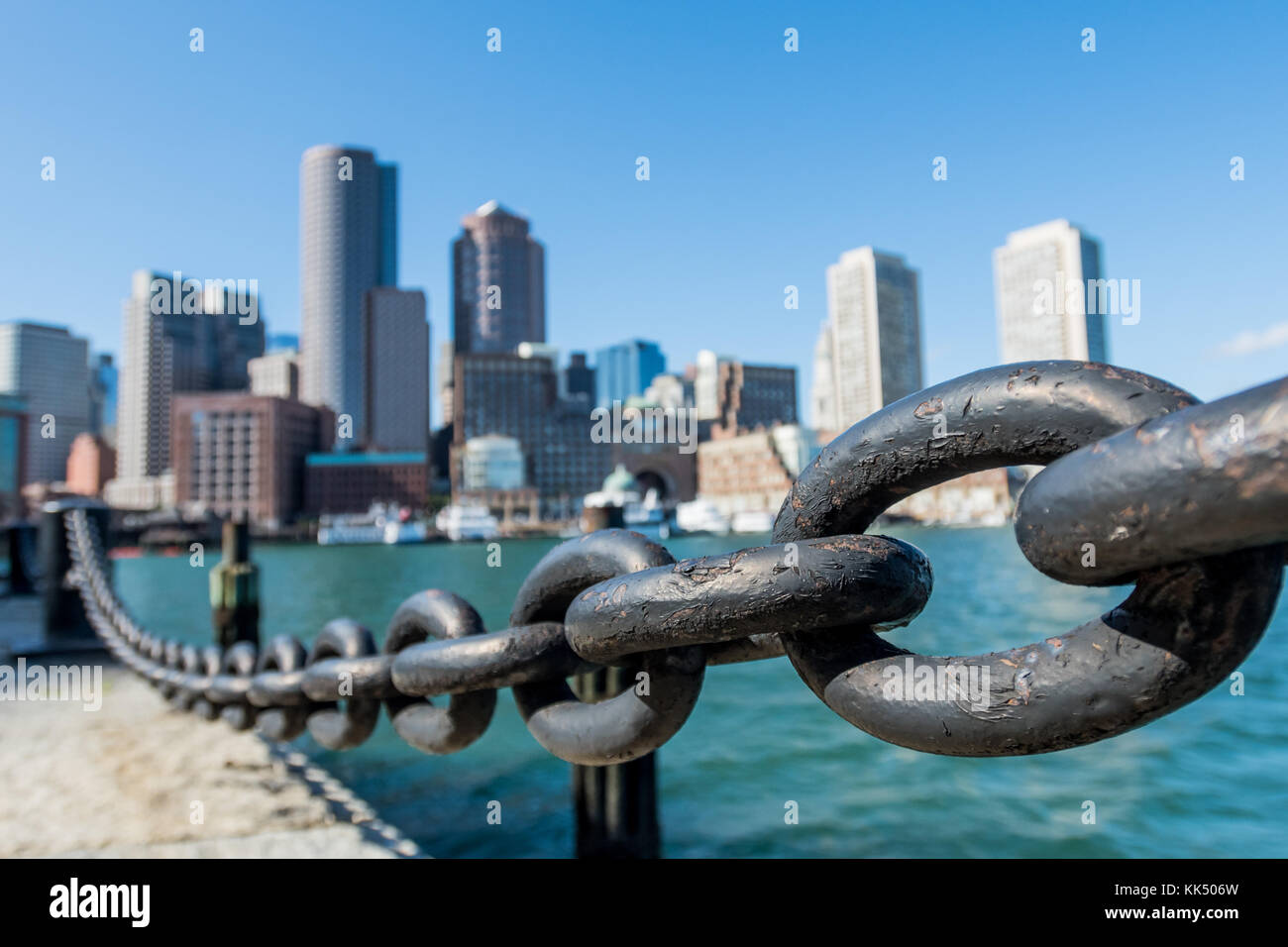 Iron Chain Along Water Front in Boston with skyline in background Stock ...