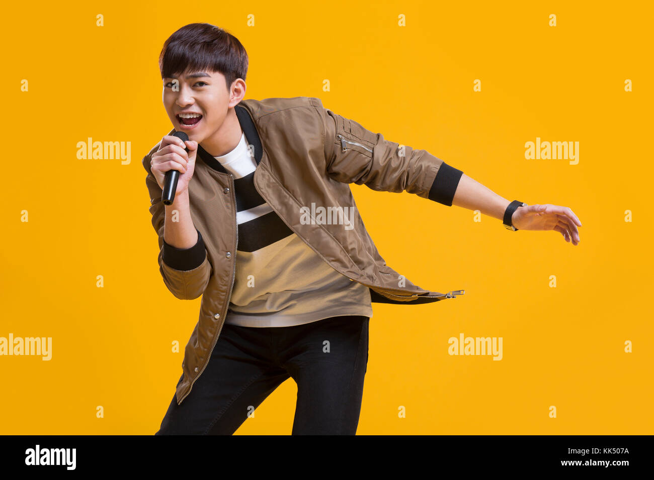 Standing performance microphone arts culture and entertainment smiling hi-res stock photography ...