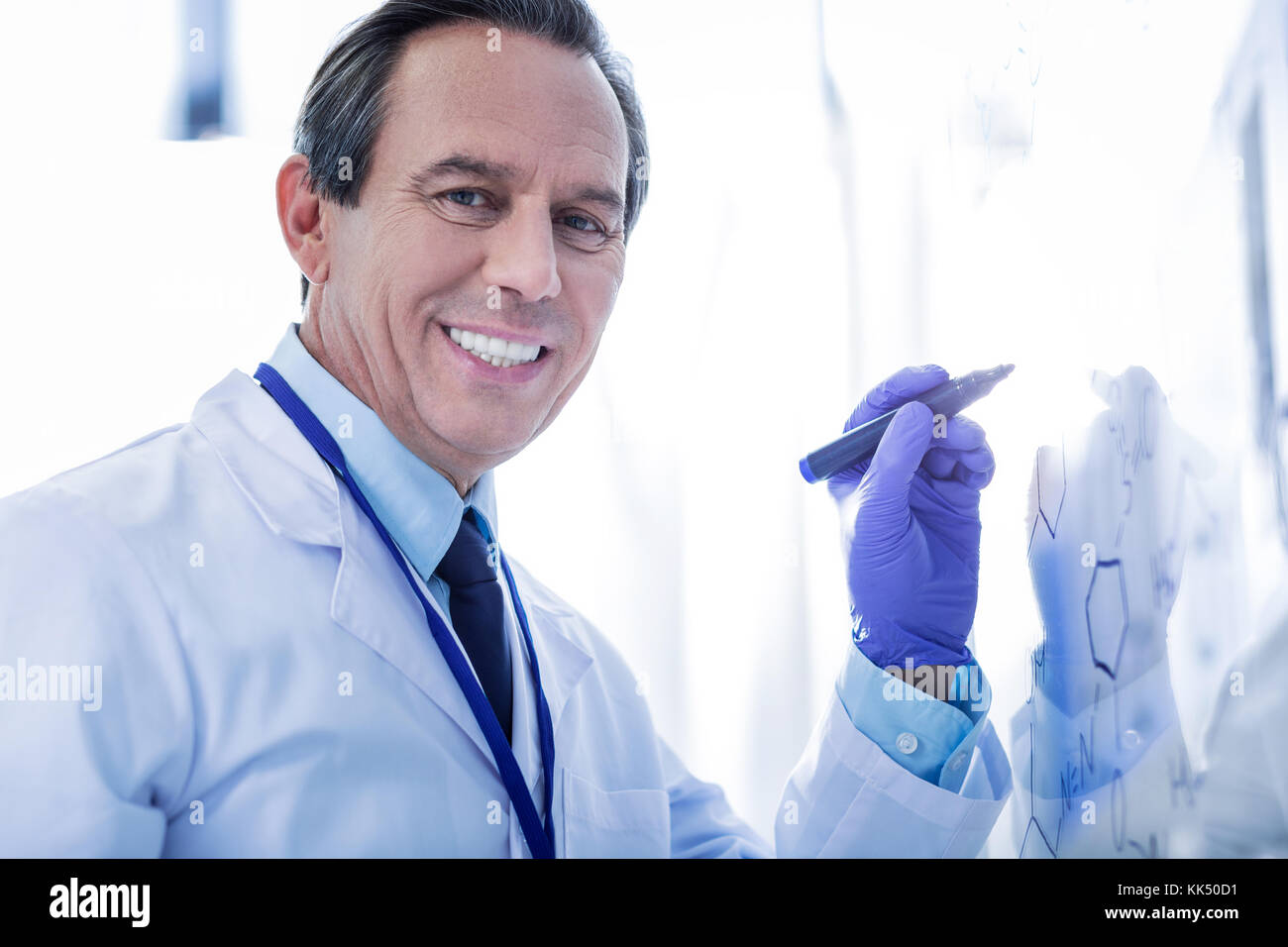 Happy adult man working in the lab Stock Photo - Alamy