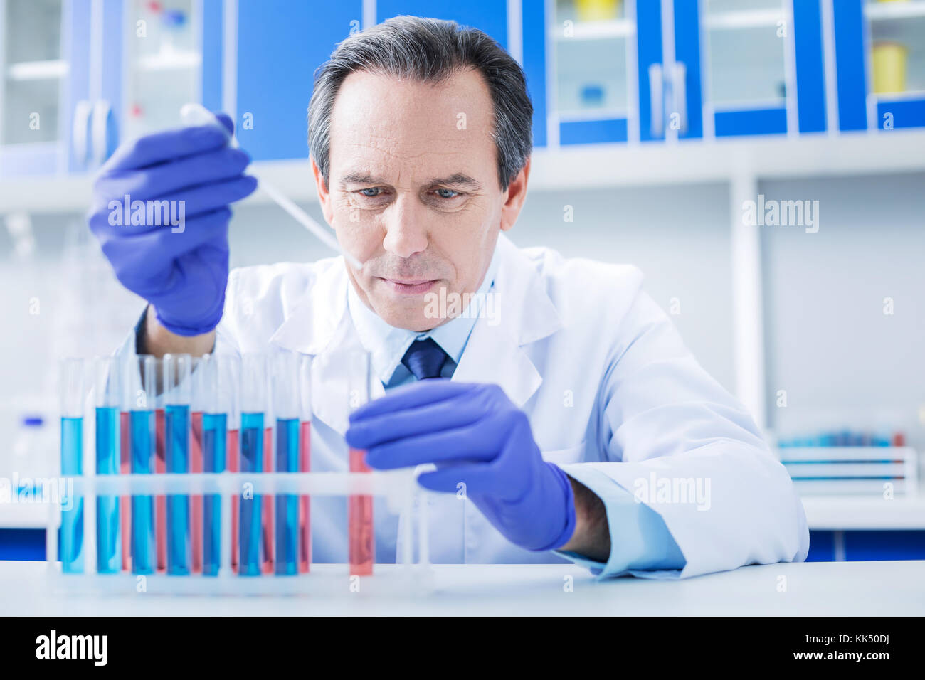 Serious professional researcher taking samples Stock Photo - Alamy