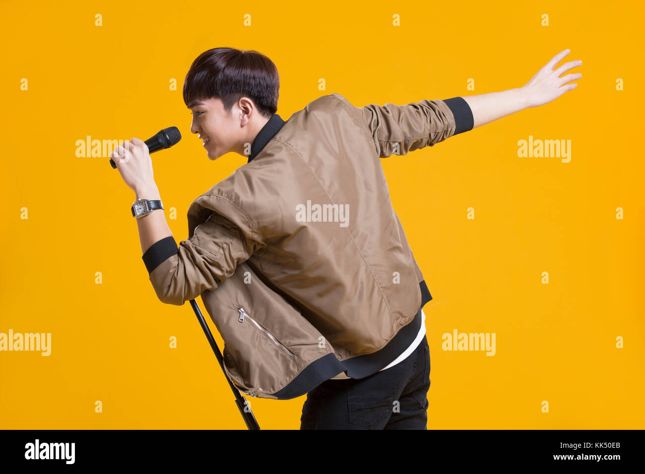 Standing performance microphone arts culture and entertainment smiling ...