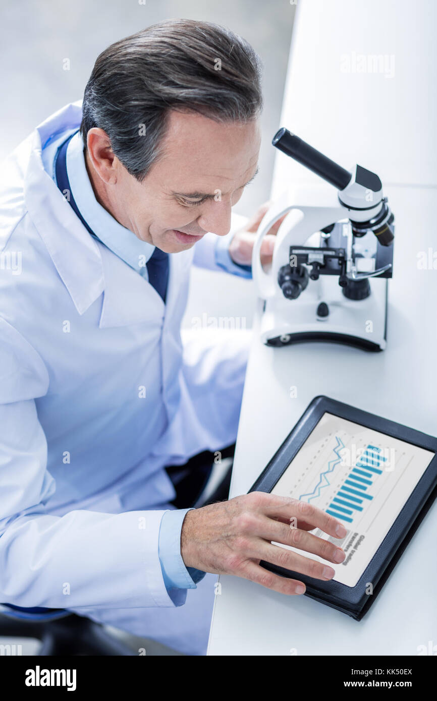 Healthcare professional using tablet monitoring hi-res stock ...