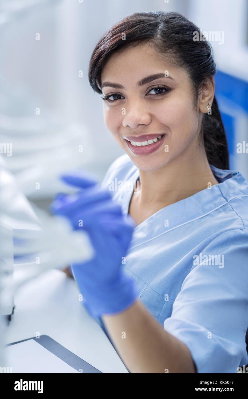 Happy nice doctor doing a genetic research Stock Photo - Alamy