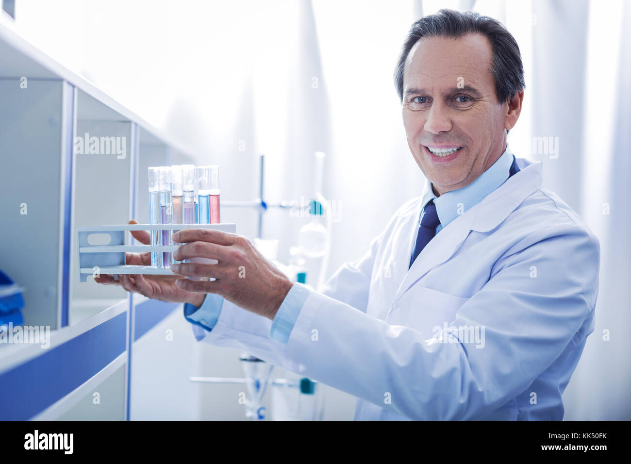 Doctor with test tubes hi-res stock photography and images - Alamy