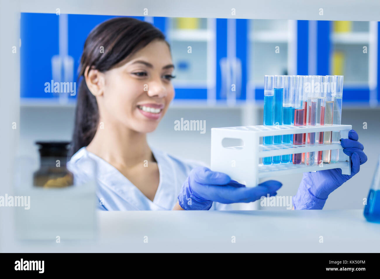 Cheerful positive woman working in the lab Stock Photo - Alamy