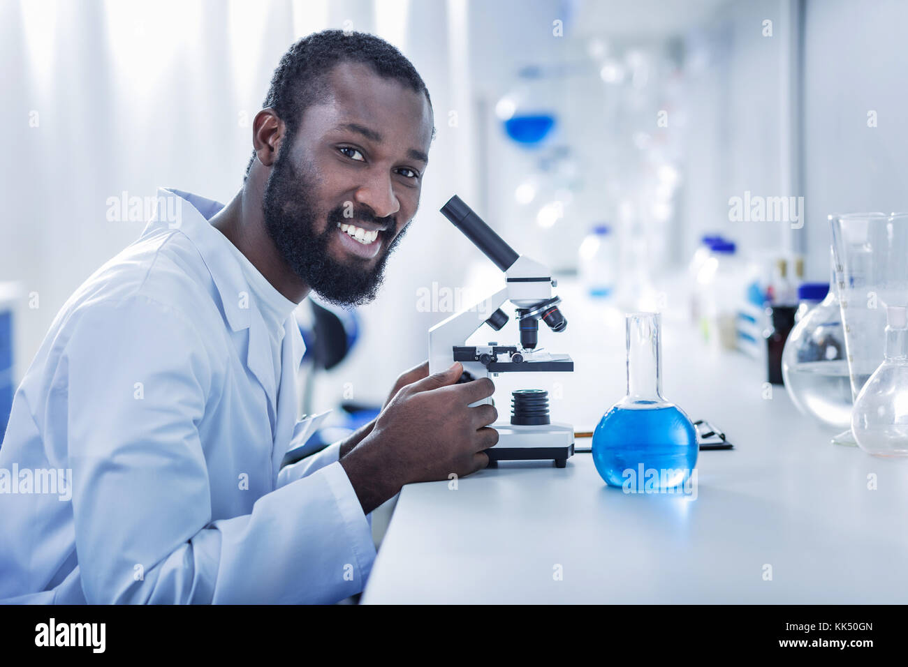 Cheerful handsome scientist looking at you Stock Photo - Alamy