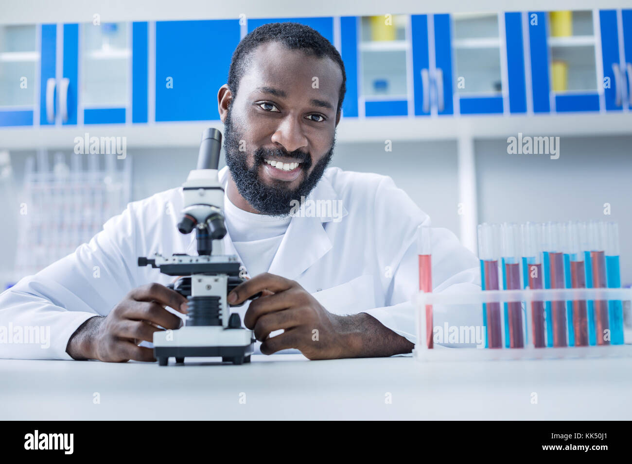 Happy handsome man looking at you Stock Photo - Alamy