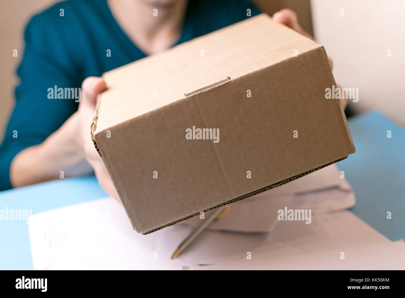 The man gives a parcel to the post office. Mail Stock Photo - Alamy
