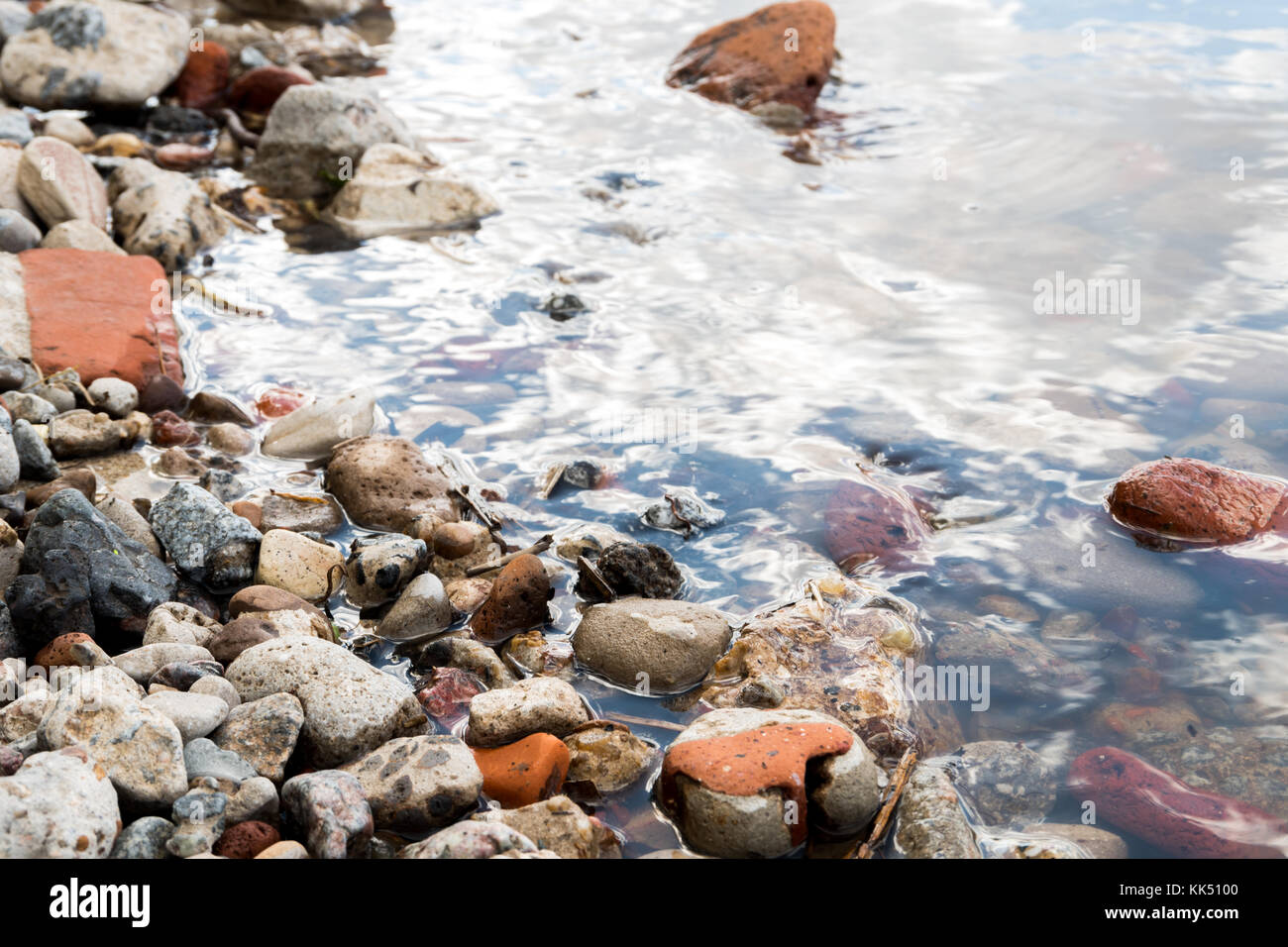Beautiful pattern of rocks, stones in the water Stock Photo - Alamy