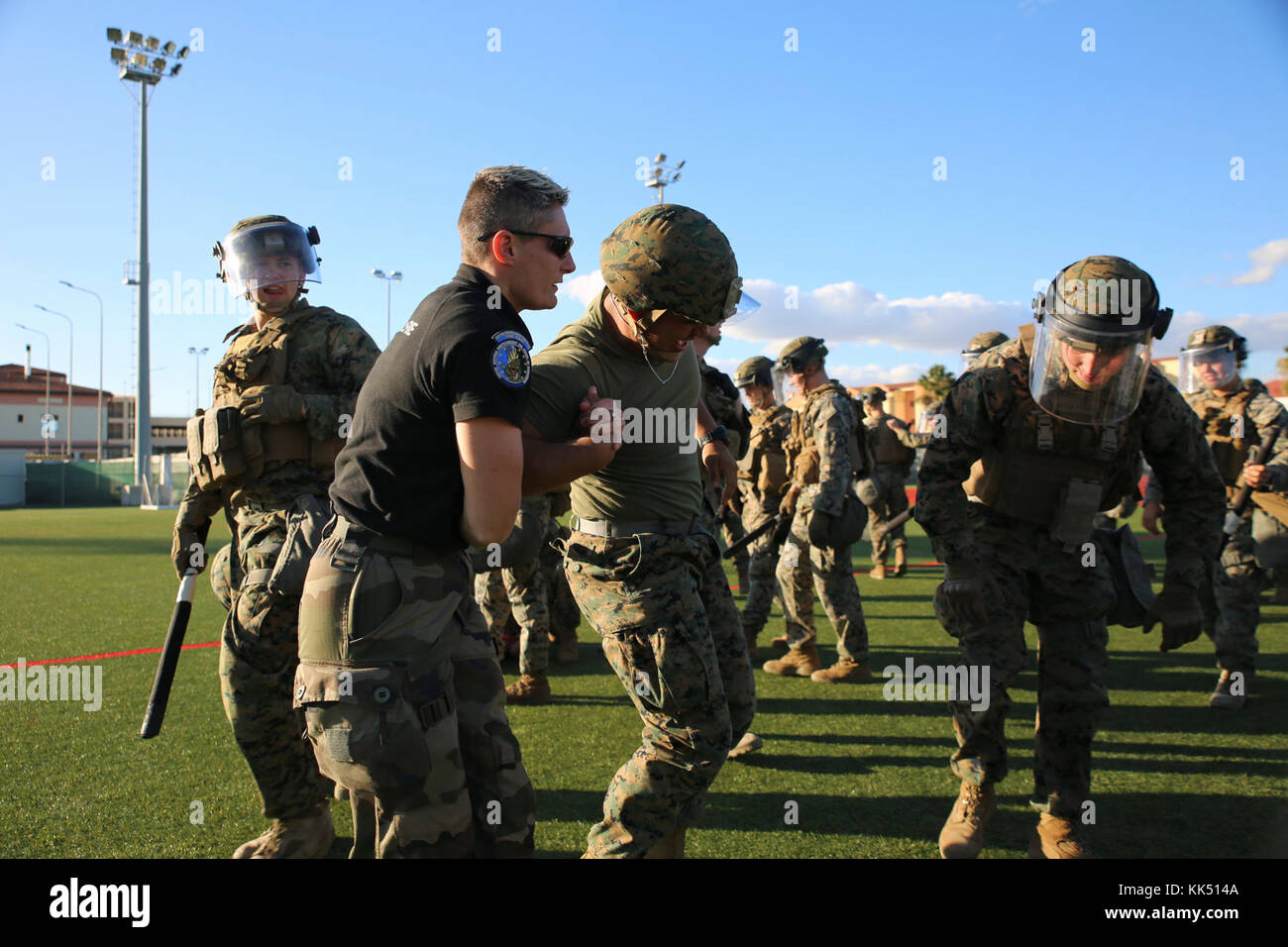An instructor from the French Gendarmerie demonstrates a detainee ...