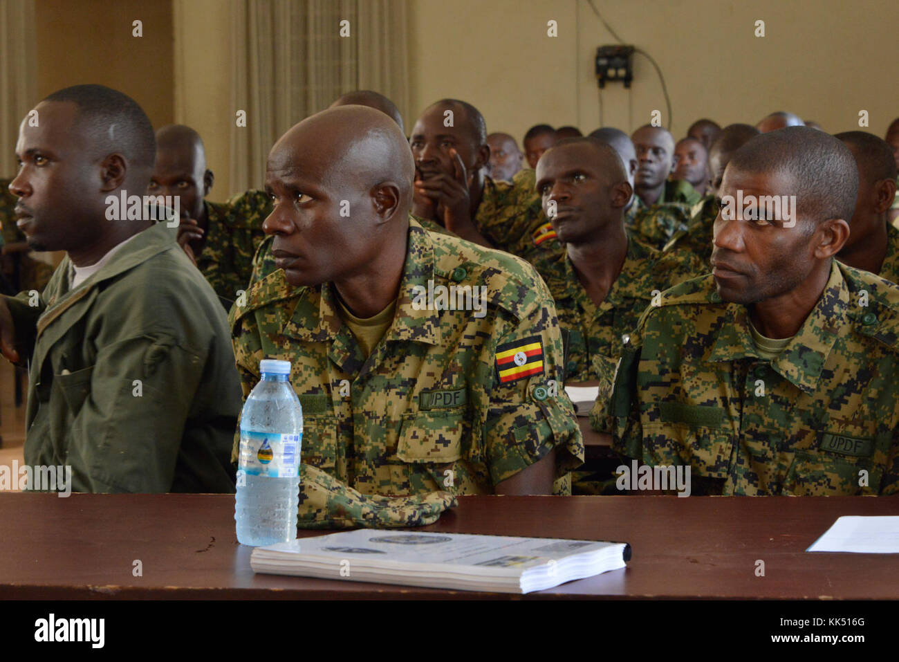 Uganda People’s Defense Force soldiers listen as a U.S. Marine with ...
