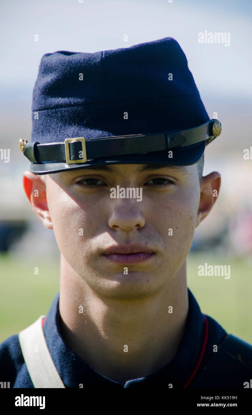 A Marine dressed as a Civil War Marine stands at attention during the ...