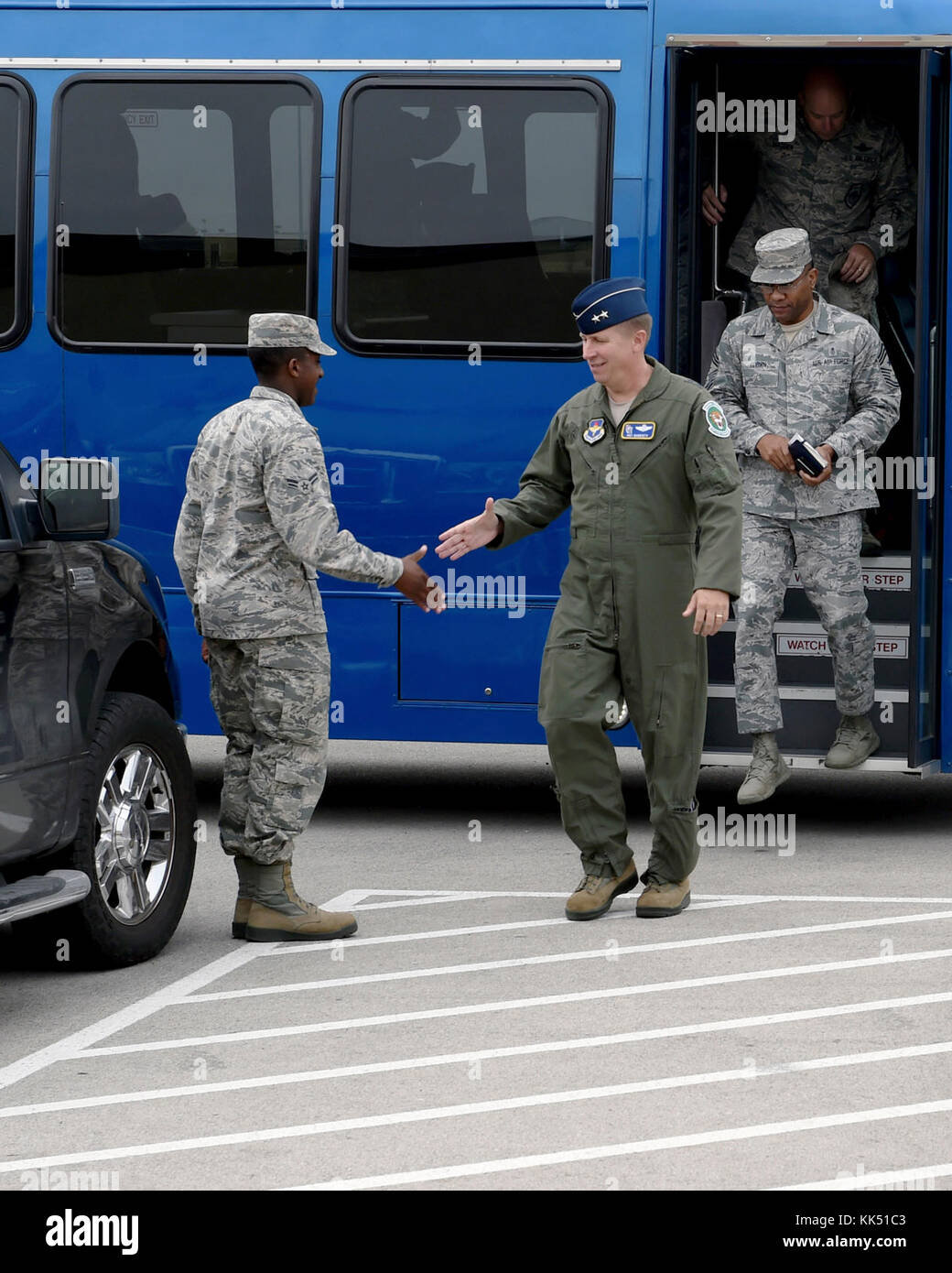 Maj. Gen. Patrick Doherty, the 19th Air Force commander, shakes hands ...