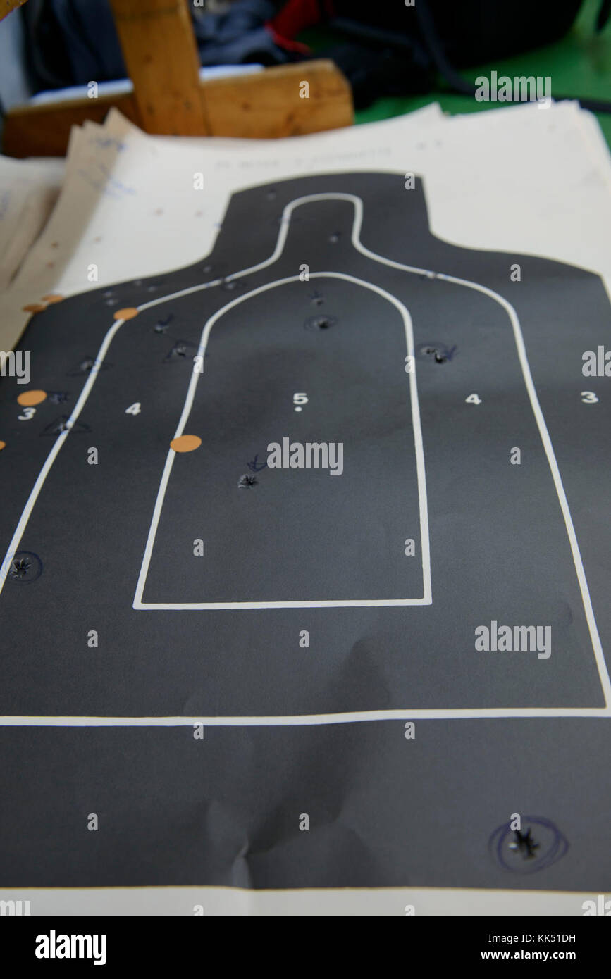 Bullet impacts are marked and counted on the targets as U.S. Soldiers ...