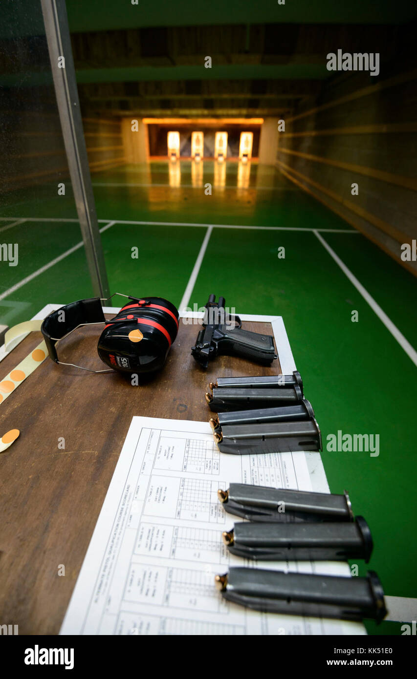 An alternate M9 pistol qualification course scorecard, magazines, an M9 ...