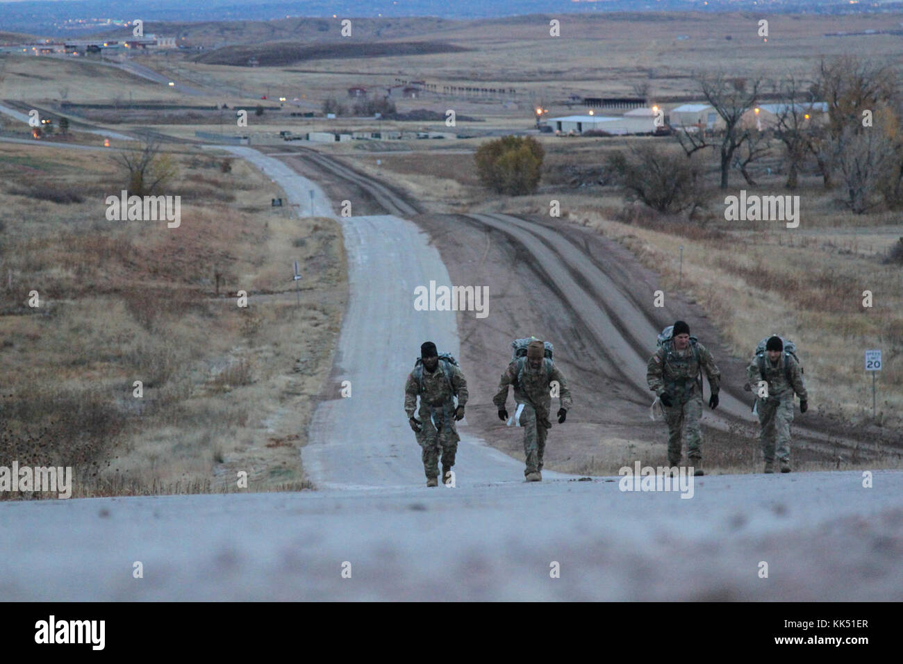 U.S. Army Soldiers, assigned to USASOC, compete in a timed 12-mile ruck ...