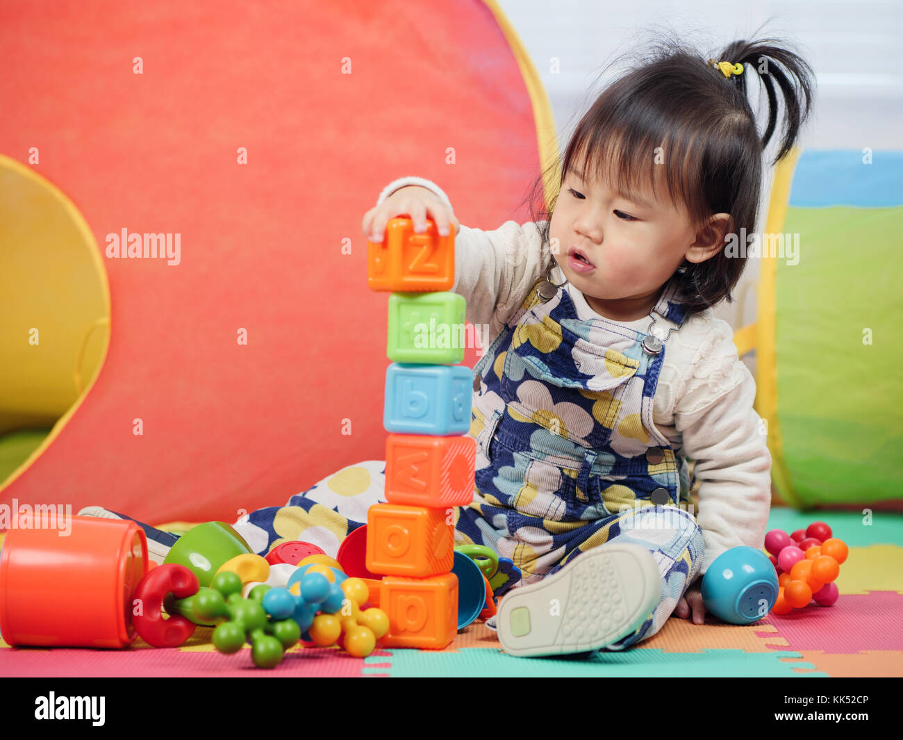 baby girl play toy at home Stock Photo - Alamy