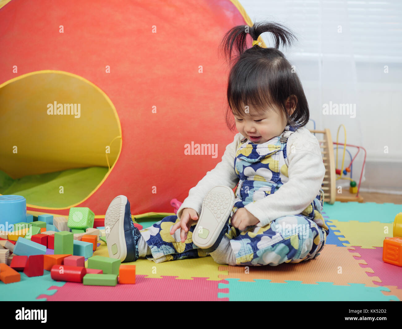 baby girl play toy at home Stock Photo - Alamy