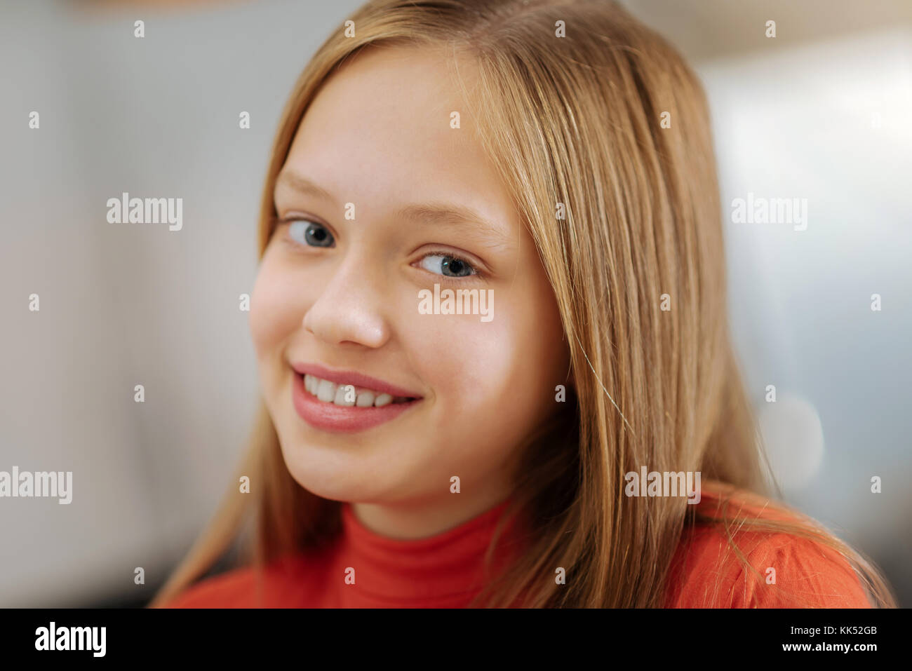 Beautiful face. Portrait of a joyful nice elated girl smiling and ...