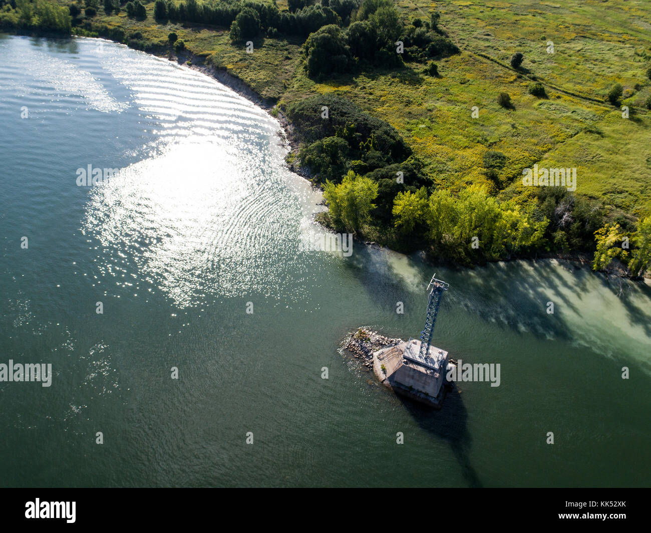 Aerial view of lighthouse and island shoreline on the St. Lawrence ...