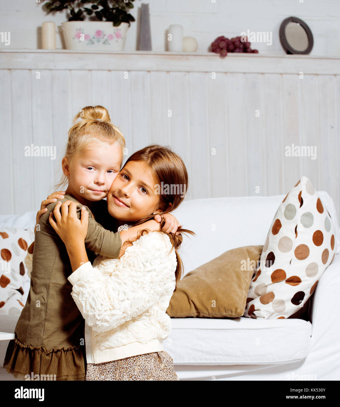 two cute sisters at home playing Stock Photo - Alamy