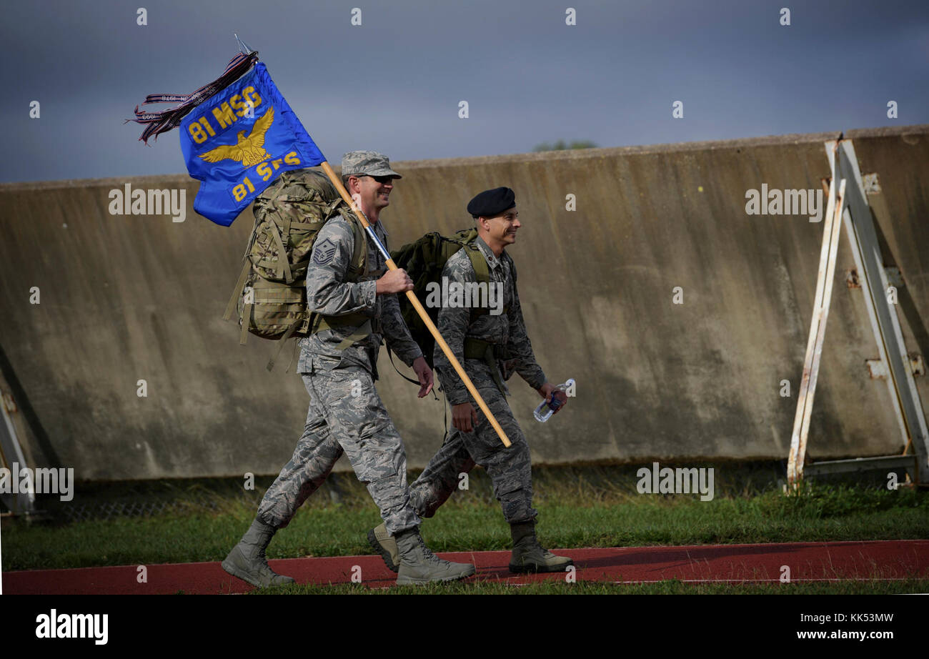 Master Sgt. Jason Burdett, 81st Security Forces first sergeant, carries ...