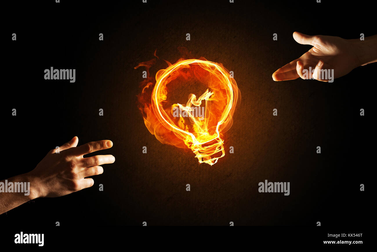 Concept of electricity or inspiration with burning light bulb and ...