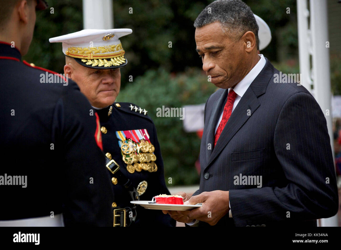 Commandant of the Marine Corps Gen. Robert B. Neller, left, passes a ...