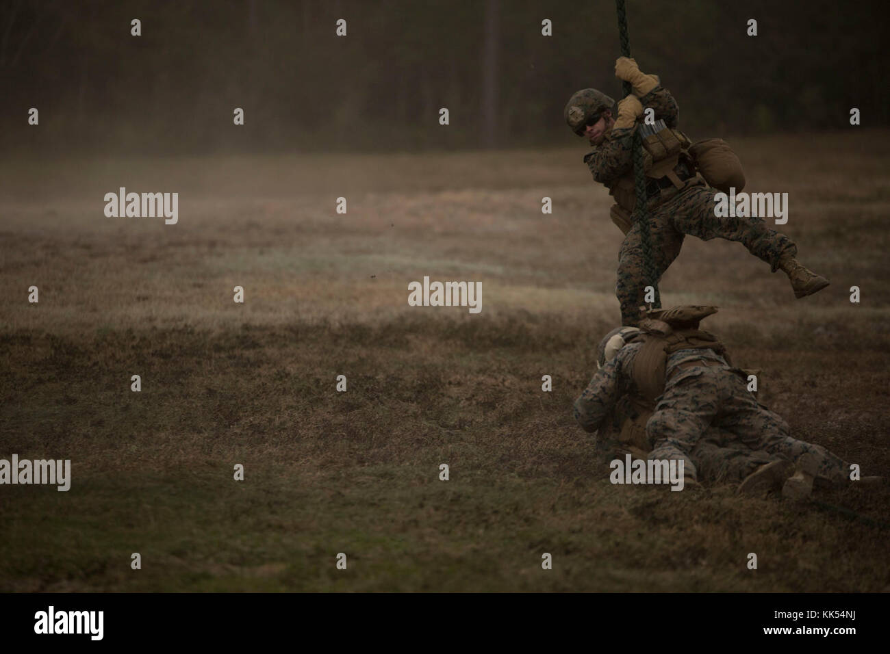 Marines secure a fast rope while a squad member descends during Fast ...