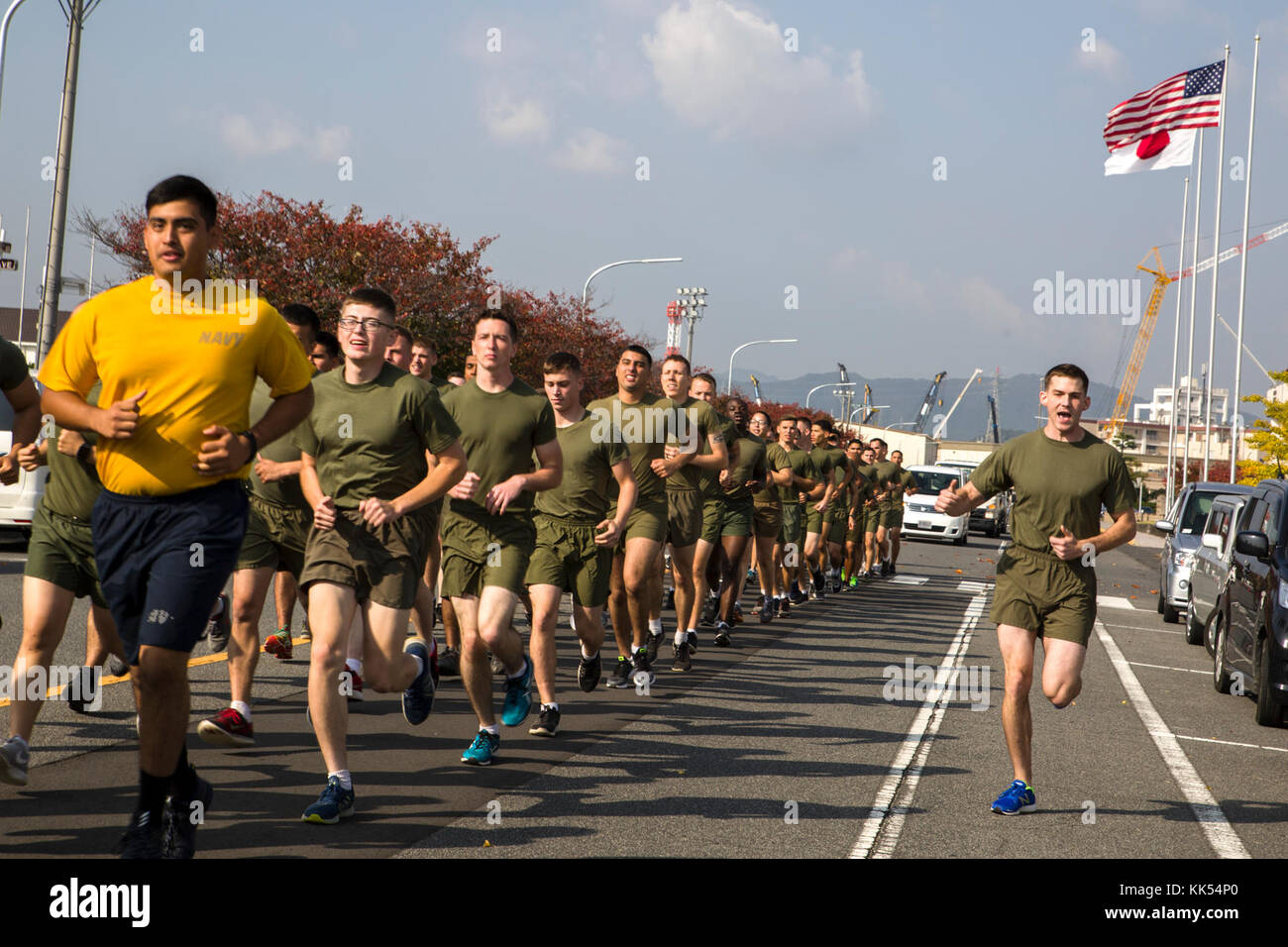 U.S. Marines and Sailors with Marine Aircraft Group (MAG) 12 run in ...