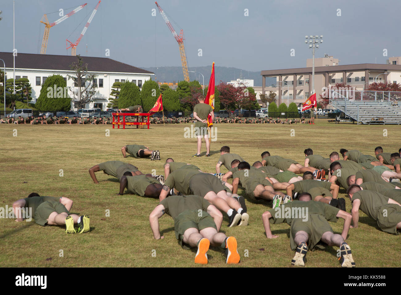 U.S. Marines with Marine Aircraft Group (MAG) 12 execute push-ups to ...