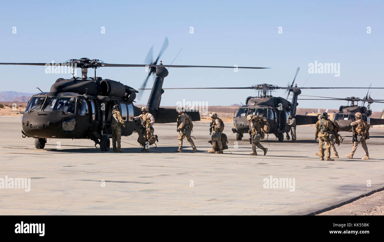 U.S. Marines with 2nd battalion, 4th Marine Regiment load into UH-60 ...