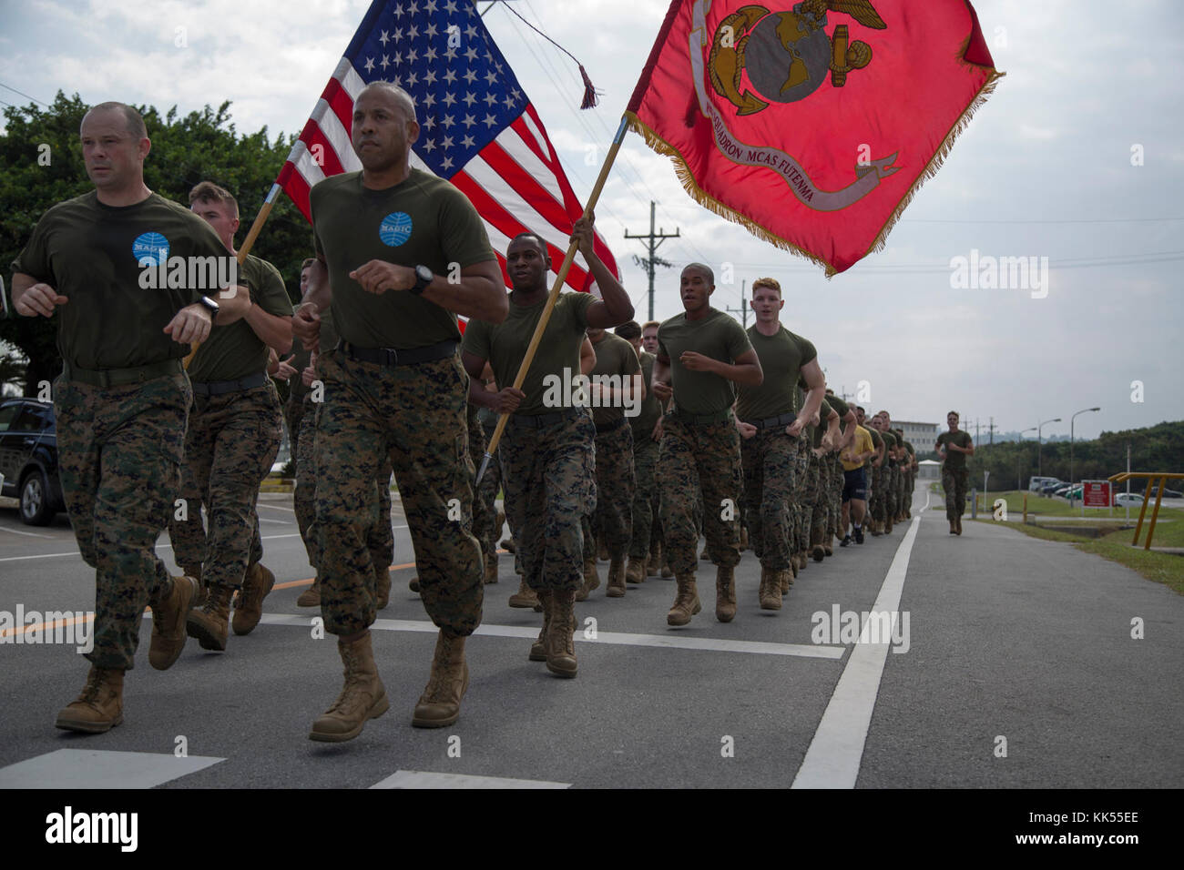 MCAS FUTENMA, OKINAWA, Japan— Marines and sailors run in formation ...