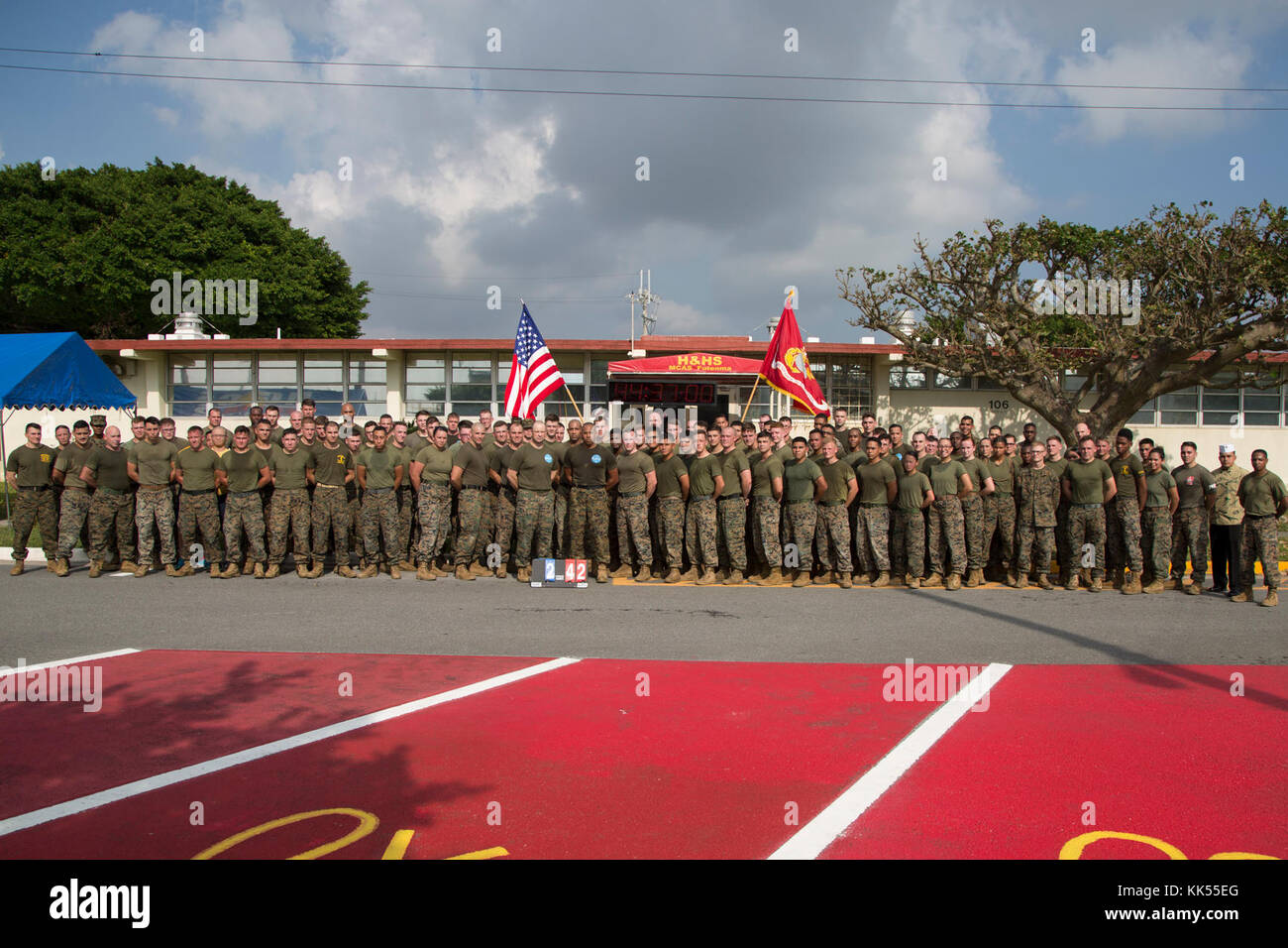 MCAS FUTENMA, OKINAWA, Japan— Marines and sailors pose for a group ...