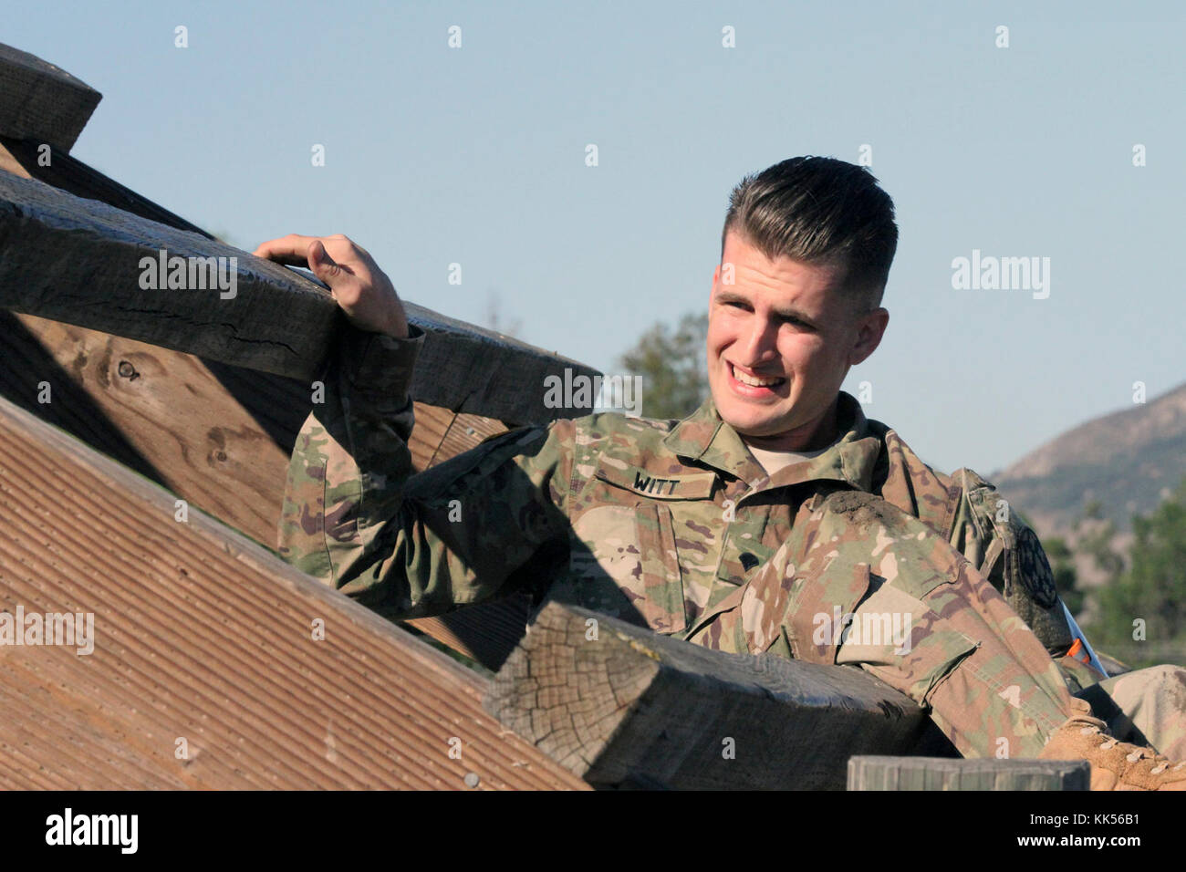 Spc. Devon Witt works his way through The Weave, an overhead challenge ...