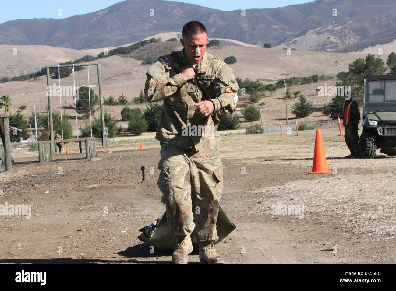 Sgt. Joshua Monday drags a 180-pound medical prop to the obstacle ...