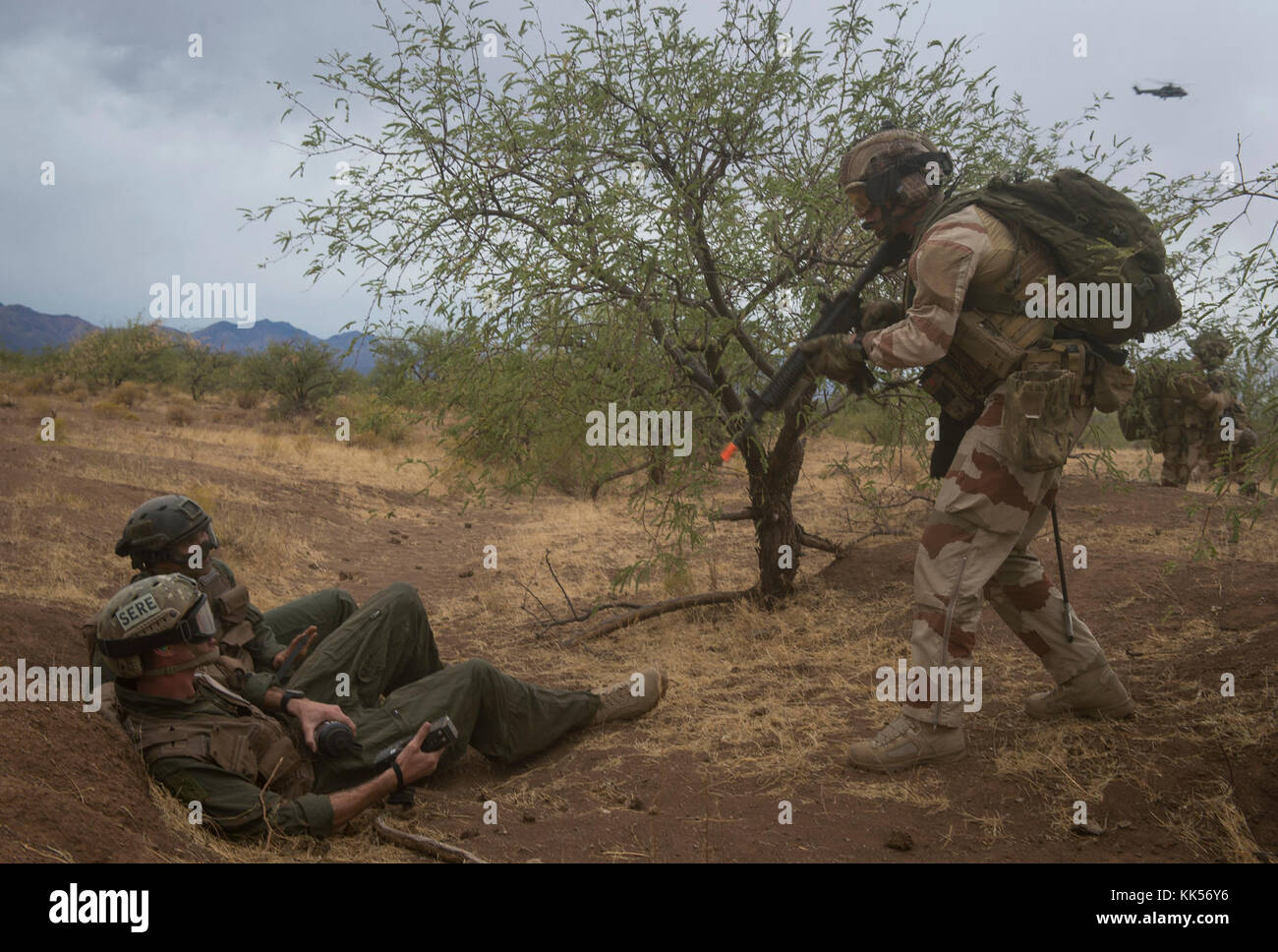 A French Air Commando makes contact with two isolated personnel before ...