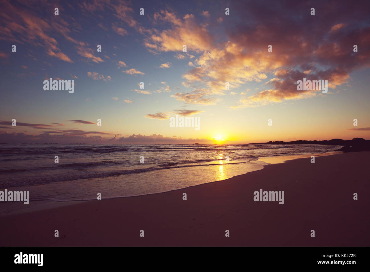 Scenic sunset at the sea coast Stock Photo - Alamy