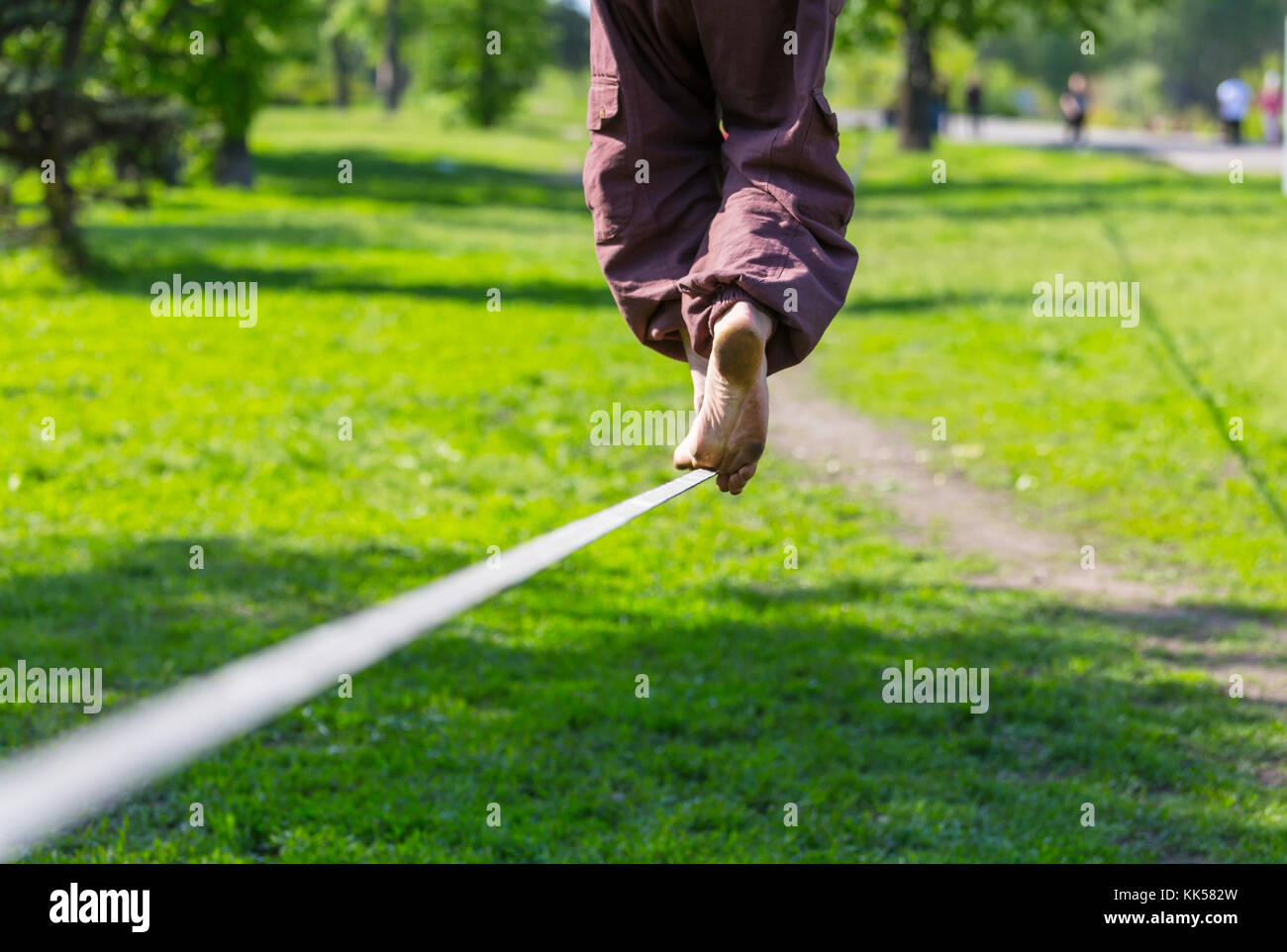 Slacklining is a practice in balance Stock Photo - Alamy